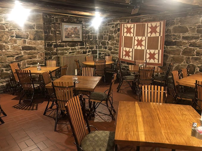 The dining room feels like colonial America's coziest corner. That quilt on the wall isn't just decoration&mdash;it's a textile time machine.