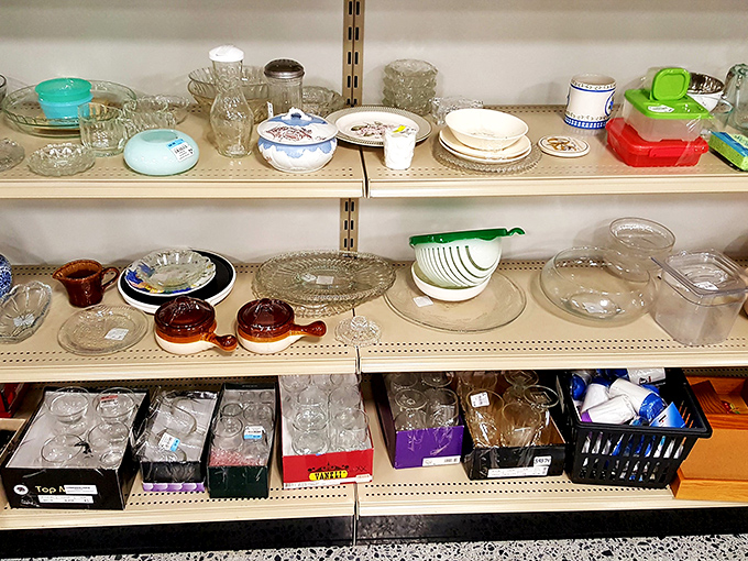 Glassware galore! Mismatched sets and vintage serving pieces stand ready to host your next dinner party. Pyrex collectors, prepare your shopping carts.