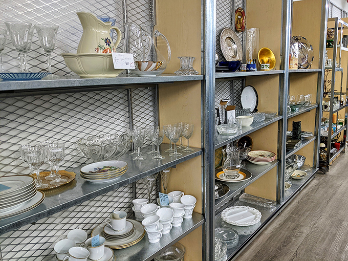Crystal stemware and everyday dishes coexist democratically on these shelves &ndash; one person's downsizing becomes another's dining room upgrade.