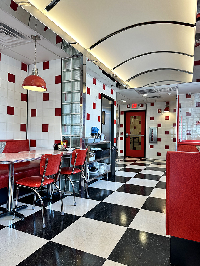 Red chairs, chrome accents, and those iconic white-and-red checkered tiles&mdash;this isn't decoration, it's a love letter to American dining.