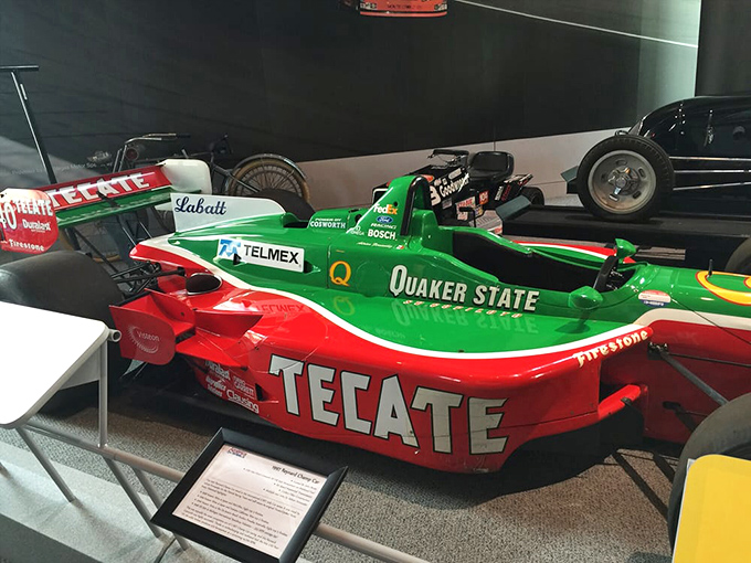 Racing dreams come alive with these Formula 1 cars, their vibrant Quaker State and Tecate liveries preserving the moment when engineering and sponsorship became inseparable partners.