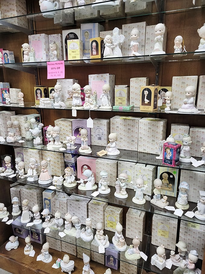An army of Precious Moments figurines stands at attention, ready to deploy maximum cuteness to any available shelf space.