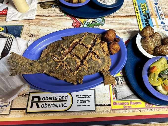 This whole fried flounder looks like it swam directly from the Gulf into the fryer, achieving that perfect crispy-outside, tender-inside seafood nirvana.