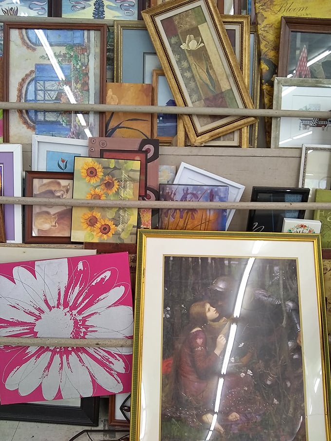 The art section: where someone's "it doesn't match our new couch" becomes your living room's conversation piece. That daisy print is practically screaming for adoption.