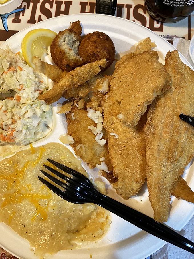 Fried flounder so perfectly golden, it deserves its own trophy. The flaky white fish inside that crispy exterior is what seafood dreams are made of.