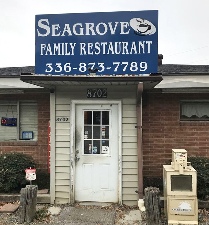 That blue sign and white door might as well be saying, "Come on in, we've been expecting you." Small-town hospitality begins at the threshold.