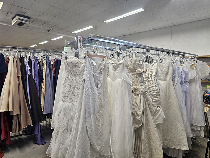 Wedding dresses hang in ghostly formation, each with stories of "I do" behind them, now waiting for new brides to write their own chapters.