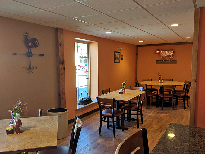 Country charm meets practical comfort in this dining area. The rooster and cow d&eacute;cor aren't ironic statements&mdash;they're respectful nods to the agricultural heritage that makes this food possible.