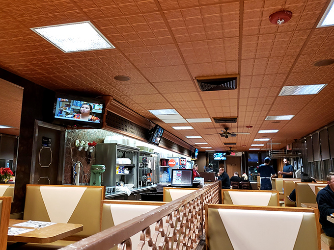 The diner's interior &ndash; where time slows down just enough to enjoy another cup of coffee. Those ceiling tiles have witnessed decades of "I'll just have one more bite."