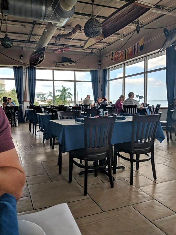 Fish mounts and nautical touches that somehow avoid the "tacky seafood joint" trap&mdash;this is maritime decor done right.