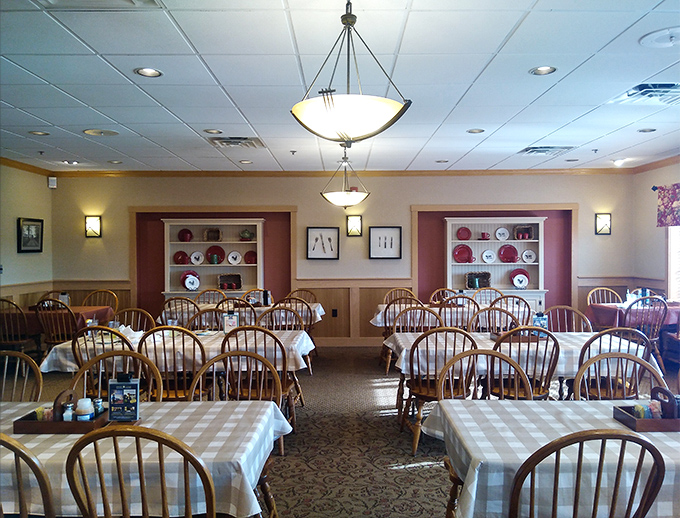 Another dining room view showcasing the thoughtful touches&mdash;built-in display shelves holding decorative plates that remind you this isn't your average roadside eatery.