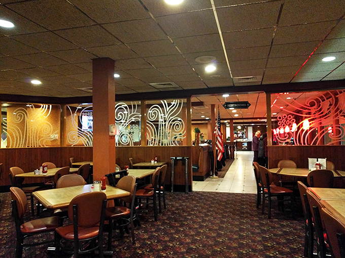 Swirling patterns on the walls create visual warmth that matches the food's embrace perfectly.
