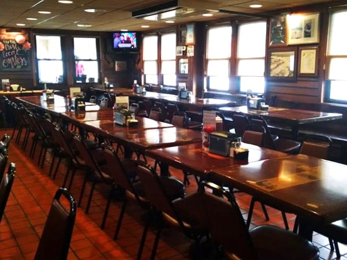 Long communal tables where strangers become friends over shared crab-cracking techniques and stories of "the one that got away."