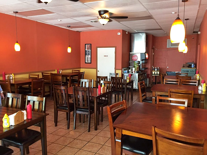 The dining room says "make yourself at home" while the pendant lights whisper "but we're still fancy enough for date night."