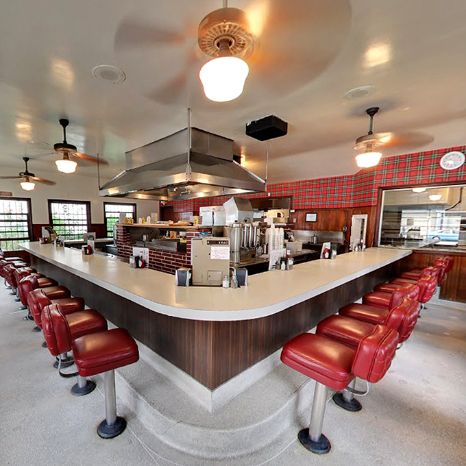 The U-shaped counter isn't just efficient design; it's theater-in-the-round where burgers are the stars and every seat is the best in the house.