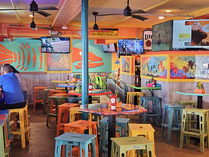 Where Florida's color palette comes to party. The bar area's rainbow of stools and vibrant murals create an atmosphere that's equal parts beach shack and tropical celebration.
