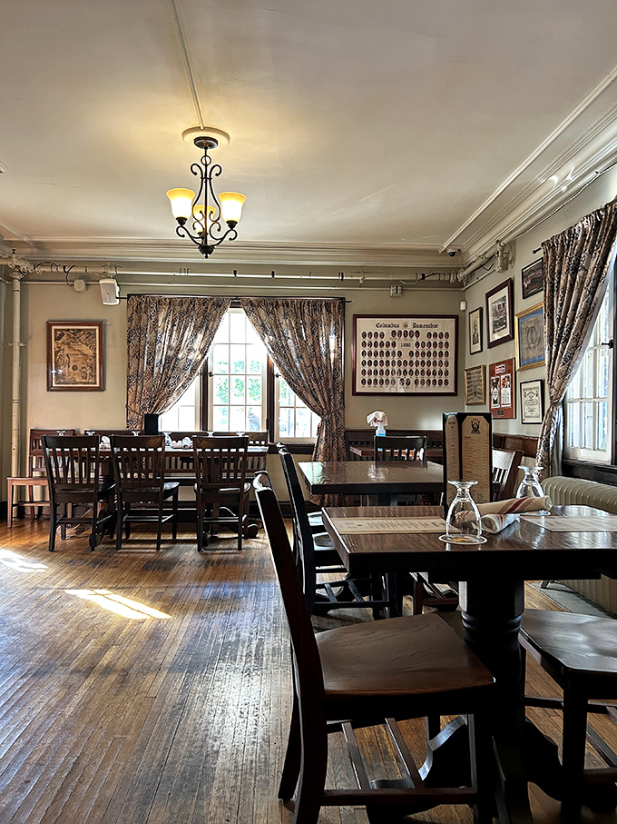 Sunlight streams through patterned curtains onto polished wood floors&mdash;dining rooms like this make you want to linger over coffee and conversation.