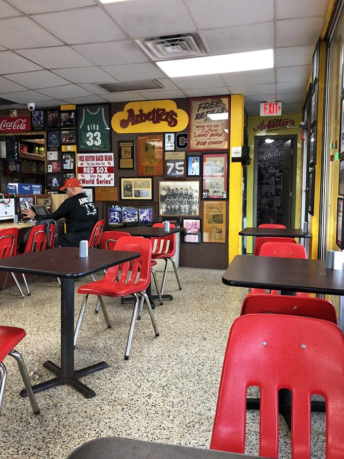 Red chairs against yellow walls create a cheerful diner atmosphere where calories don't count and napkins are absolutely necessary.