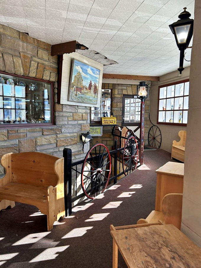 Sunlight streams through windows illuminating handcrafted furniture and wagon wheels – a quiet corner where you can sit and contemplate your next pie purchase.