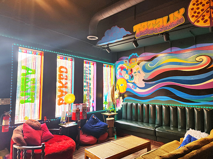 The lounge area feels like your coolest friend's basement circa 1975, complete with string lights and colors that pop like a visual soundtrack.