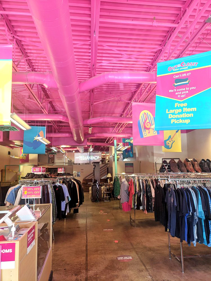 The pink ceiling creates a cheerful glow throughout the store. Even the industrial ductwork looks festive, proving that second-hand shopping doesn't have to feel second-rate.