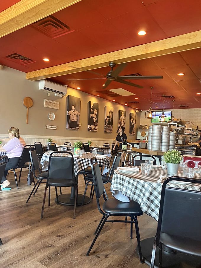 Red ceilings, wooden beams, and classic black-and-white checked tablecloths create the kind of warm ambiance that makes you want to linger over one more bite.
