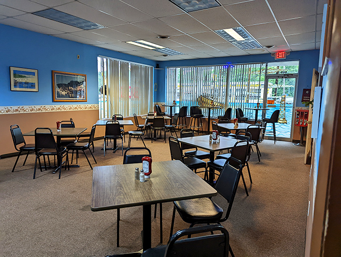 The dining room's simple, no-nonsense approach puts the focus squarely on the food. Blue walls and natural light create a casual, welcoming space.