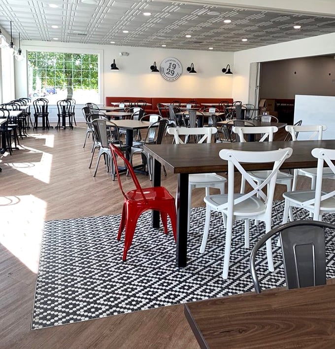 Sunlight streams through windows illuminating a dining room that balances vintage charm with modern comfort. Norman Rockwell would approve.