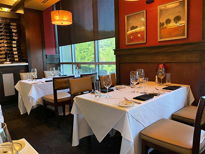 Red walls and crisp white tablecloths create the perfect backdrop for romance, business deals, or simply Tuesday night when cooking feels impossible.