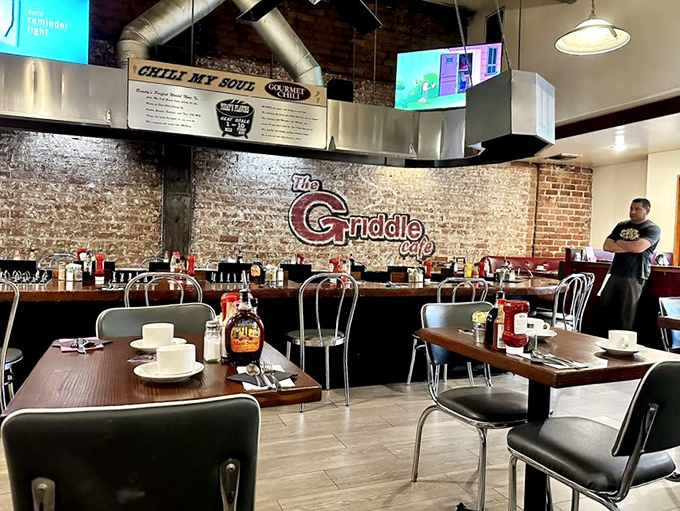 The Griddle's open kitchen and counter seating offer breakfast theater where pancake flipping becomes performance art worth the price of admission.