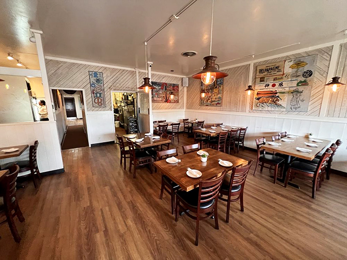 Nautical-inspired lighting casts a warm glow over wooden tables where countless chowder epiphanies have occurred.