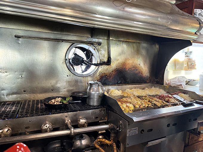 The heart of the operation where culinary magic happens on well-seasoned grills and experienced hands work wonders.