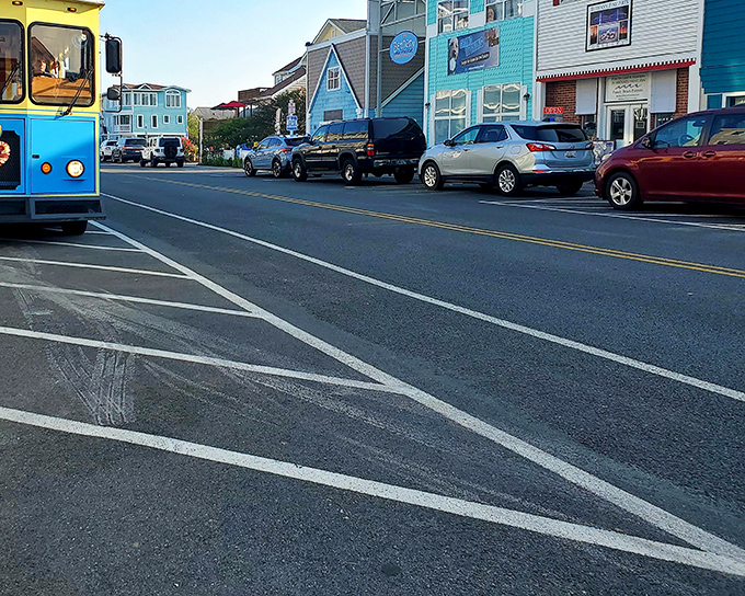 The trolley waits patiently on Garfield Parkway, Bethany's main artery, where colorful storefronts compete for attention against the blue coastal sky.