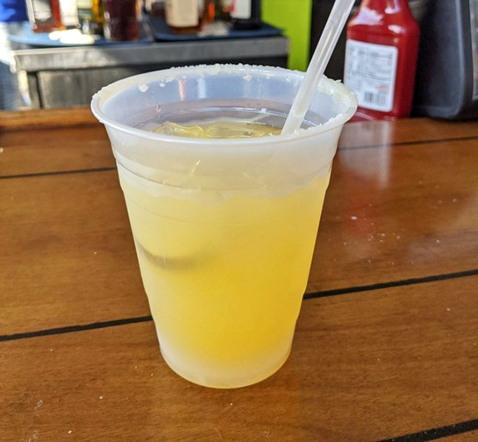 Nothing says "Florida afternoon" quite like a cold margarita on a wooden table with the promise of lake views.