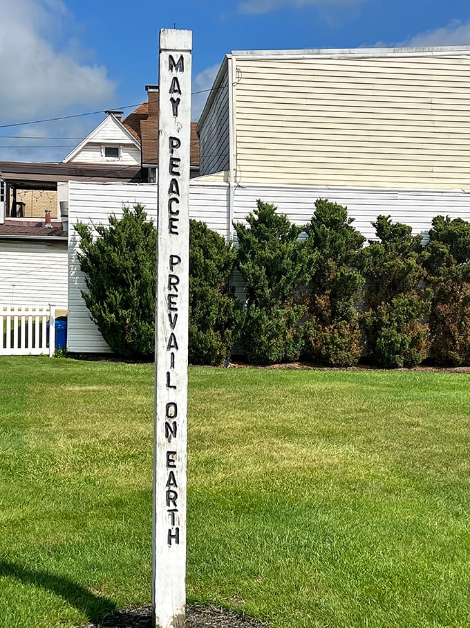 The "May Peace Prevail on Earth" marker stands as a cosmic reminder that even visitors from other planets appreciate good manners.