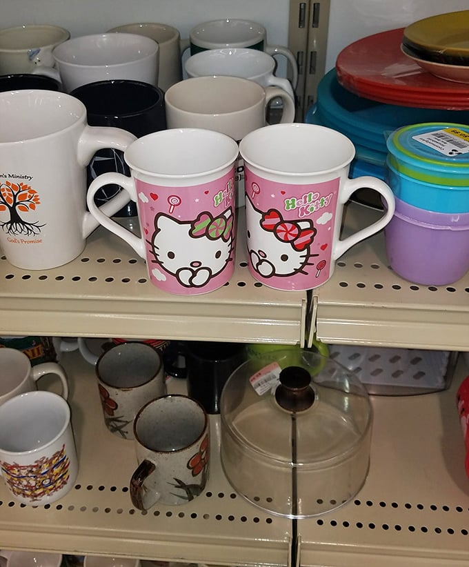 Hello Kitty mugs nestled among everyday drinkware&mdash;proof that morning coffee tastes just as good when sipped from someone else's discarded joy.
