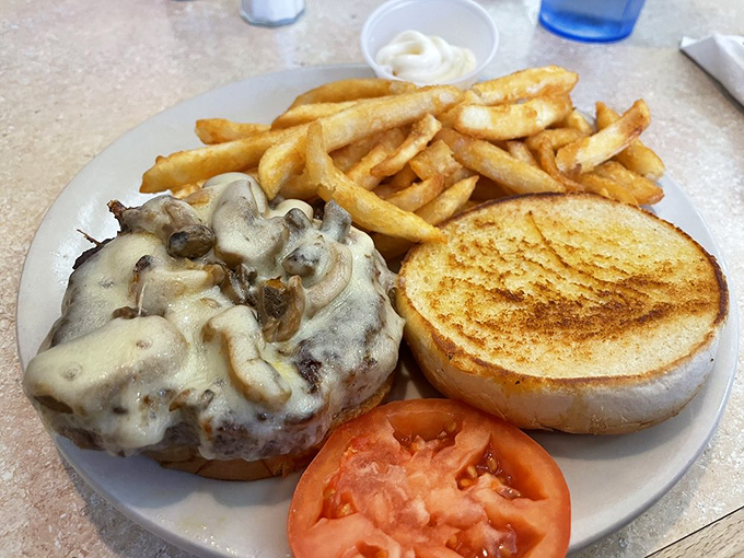 When mushrooms and Swiss cheese meet a perfectly grilled burger, magic happens on a plate&mdash;comfort food alchemy at its finest.