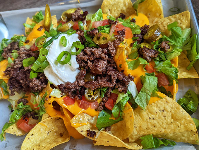 Loaded nachos that look like they were assembled by someone who truly understands the art of excess.