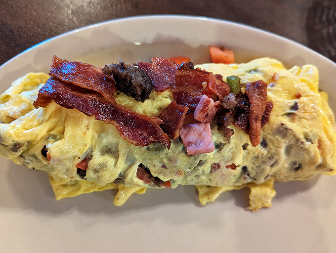 An omelet that's clearly been to the gym &ndash; bulging with fillings and topped with bacon that's achieved that perfect crispy-but-not-burnt state of excellence.