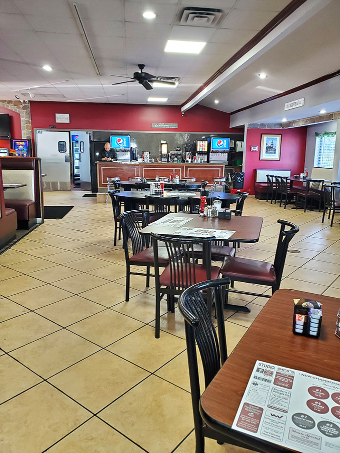 Red walls, tile floors, and tables waiting for stories to unfold. Every empty chair is just a friend you haven't met yet.