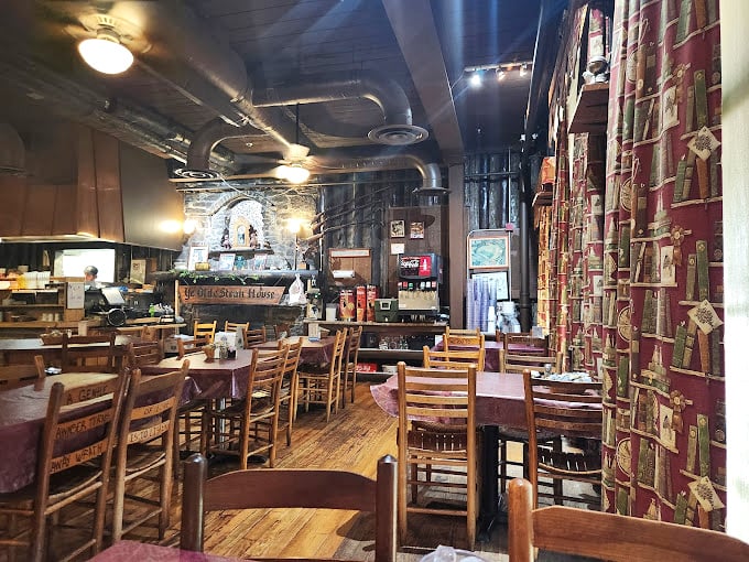 Where wooden chairs have heard decades of stories, and exposed ductwork reminds you that honest food needs no fancy ceiling.