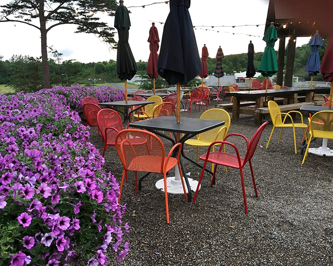 Outdoor seating surrounded by flowers that adds a touch of color almost as vibrant as the sauce-painted meat on your plate.