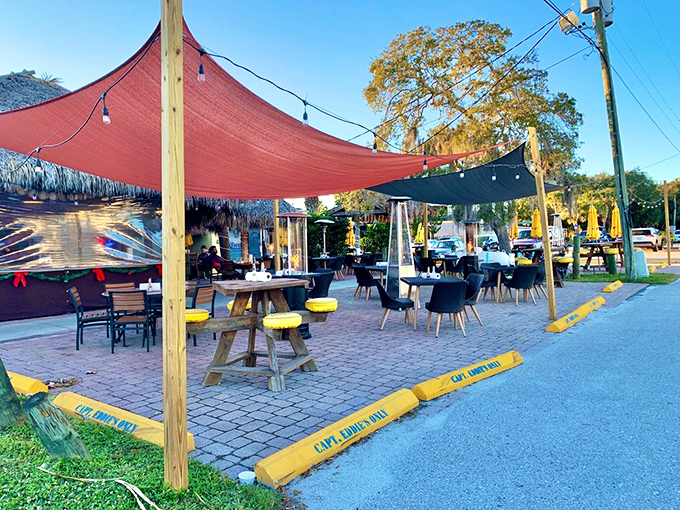 Under colorful canopies, the outdoor seating area transforms ordinary Tuesday dinners into mini-vacations, even for locals who live minutes away.