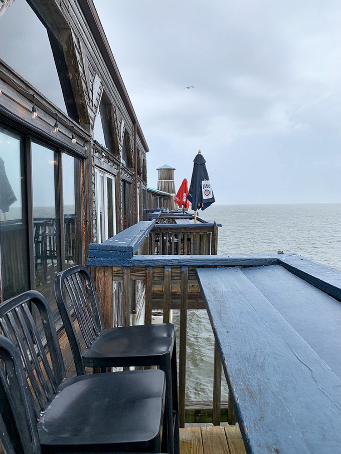 The deck at Steamers isn't just outdoor seating—it's front-row tickets to nature's best show, with cocktail service included.