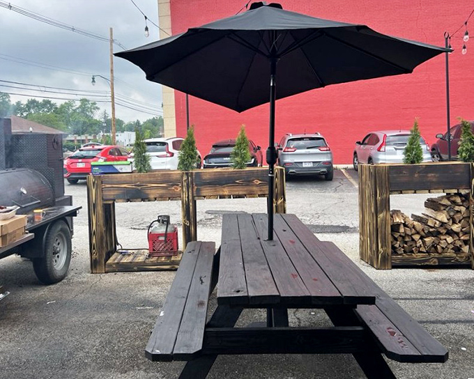 Al fresco dining with a side of wood smoke perfume. The stacked firewood isn't decoration&mdash;it's a promise of flavors to come.