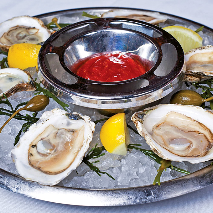 These oysters look like they've been practicing their presentation since they were baby bivalves&mdash;perfectly poised on ice with cocktail sass.