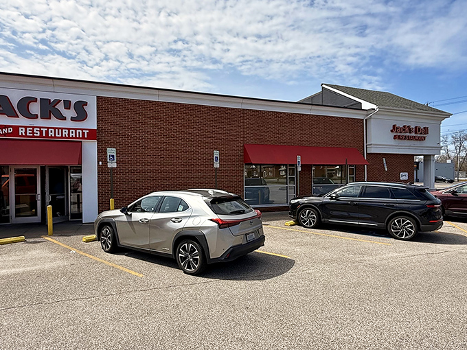 Even the parking lot tells a story—cars from every walk of life gathered in democratic harmony for the universal language of good food.
