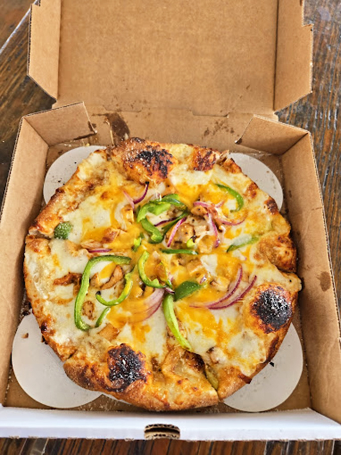 Beach pizza doesn't pretend to be Neapolitan, but with that golden crust and colorful toppings, who's complaining?