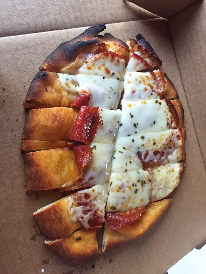 Pizza that doesn't need to name-drop Italian villages to impress you. Perfectly charred edges cradle melty cheese and pepperoni cups.