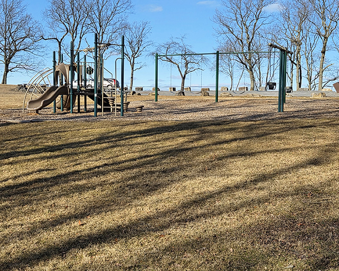 Childhood joy meets practical parenting solution. This playground offers kids an energy outlet while adults contemplate the spectacular river views nearby.